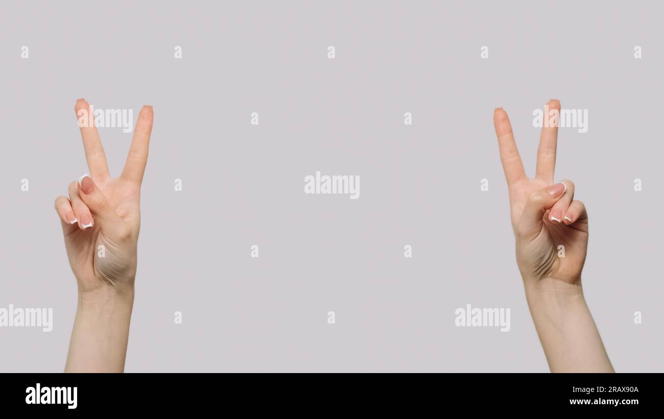 Victory sign peace gesture female hands v symbol Stock Photo - Alamy