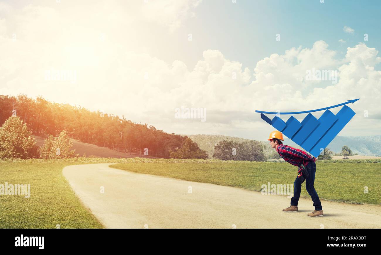 Engineer man carry progress graph Stock Photo - Alamy