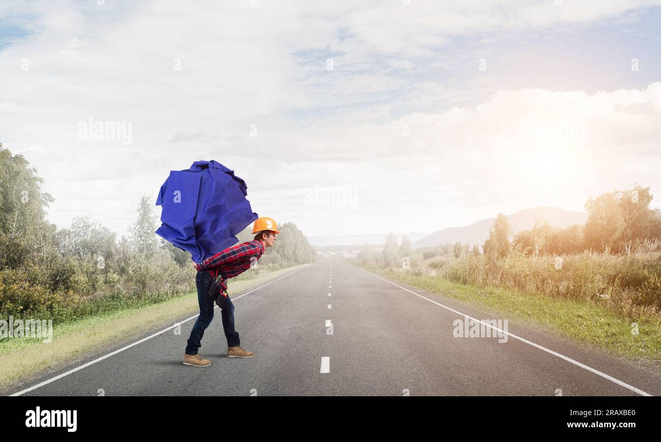 Engineer man carry load Stock Photo - Alamy