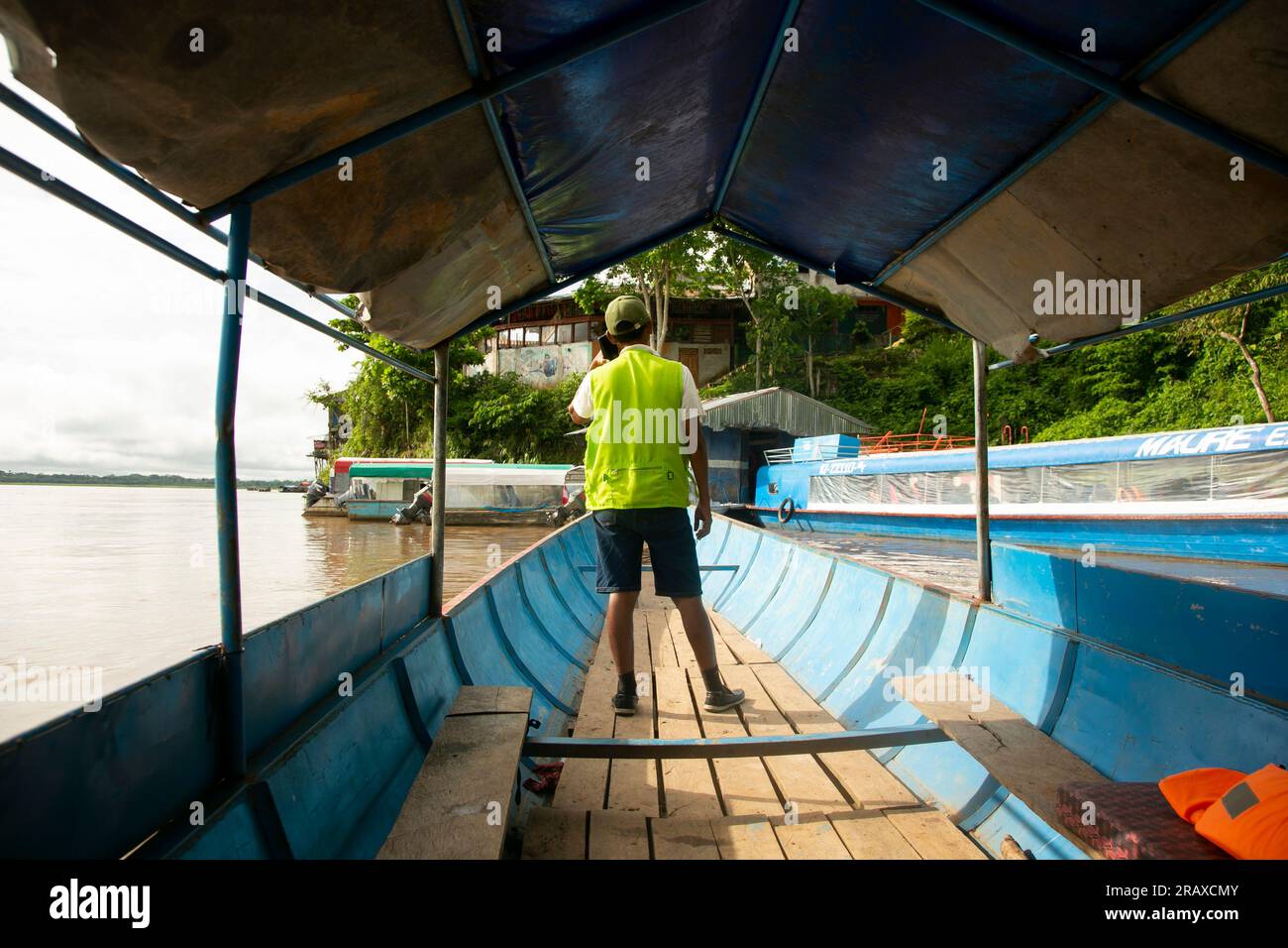 Tourist guide on a boat in the City of Yurimaguas in the Peruvian ...