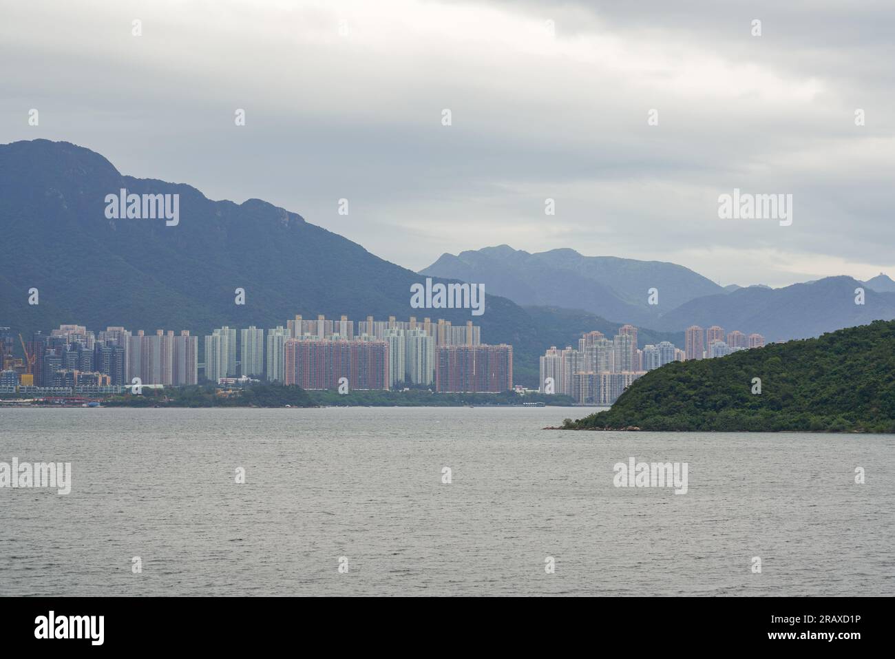 Seaside town buildings and mountains in Tai Po, Hong Kong Stock Photo ...