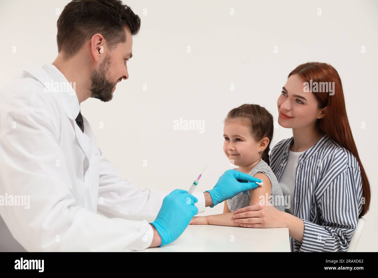 Children's hepatitis vaccination. Mother with her daughter in clinic ...