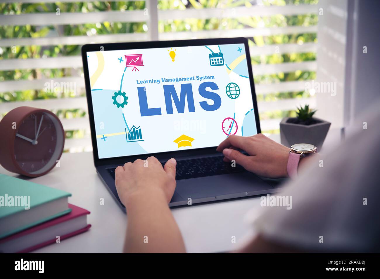 Learning management system. Woman working with modern laptop at table ...