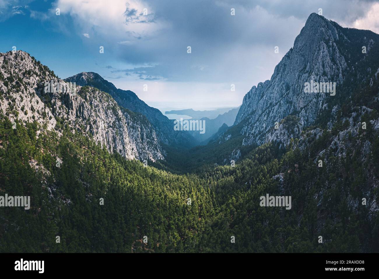 Aerial view of a mountain pass and stormy cyclone clouds in the sky ...