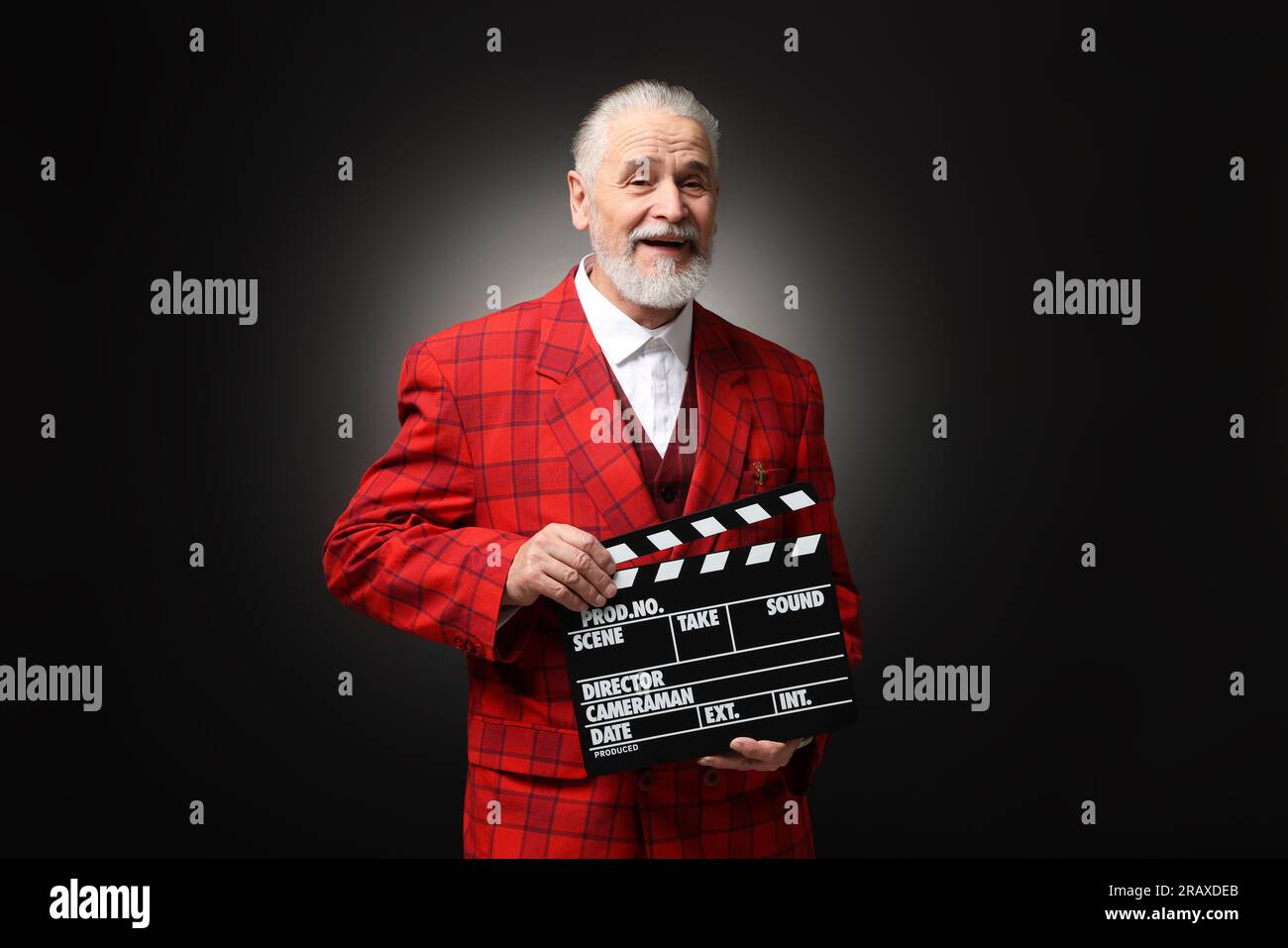 Senior actor with clapperboard on black background. Film industry Stock ...