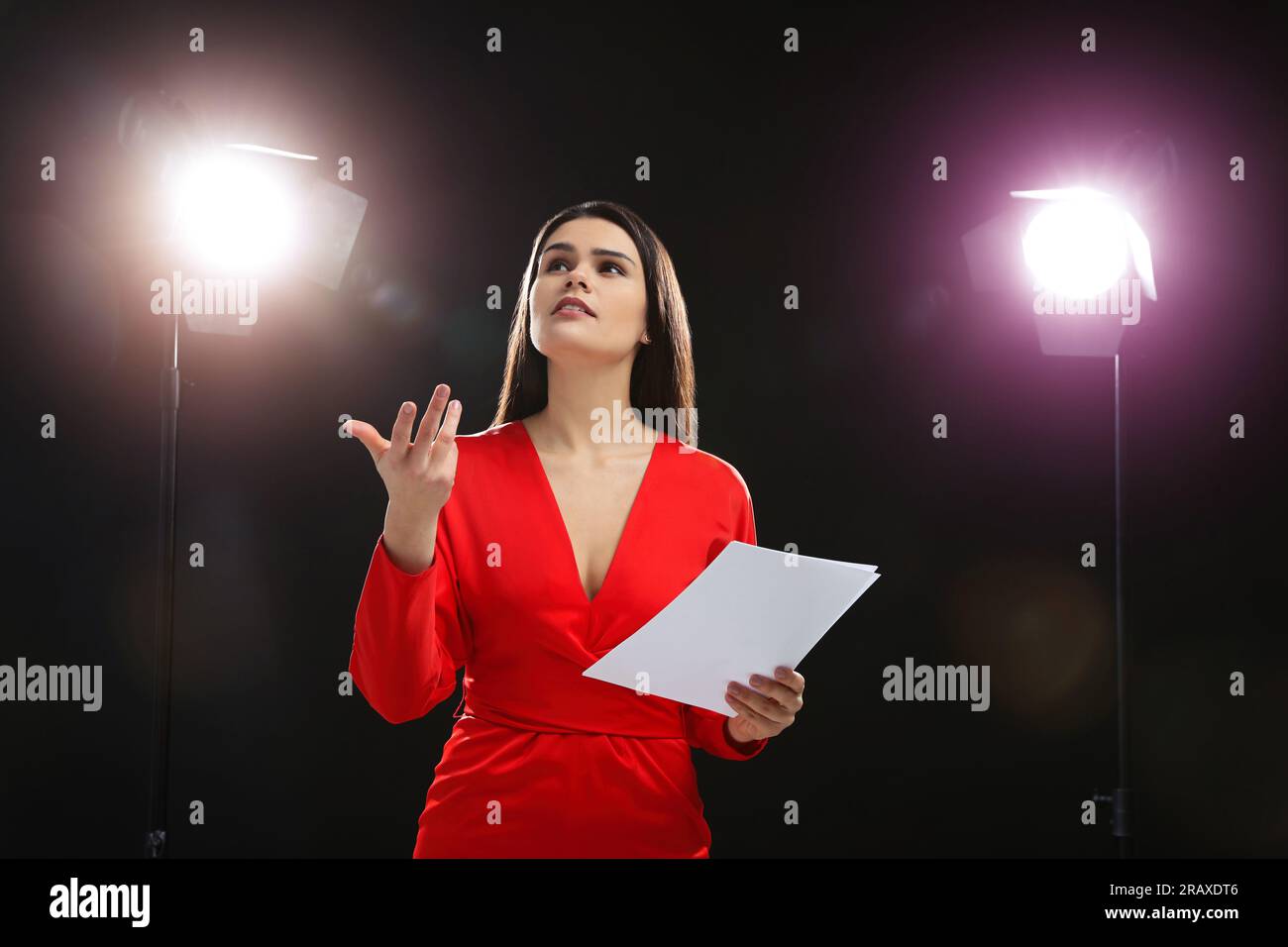 Actress with script performing on stage. Film industry Stock Photo - Alamy