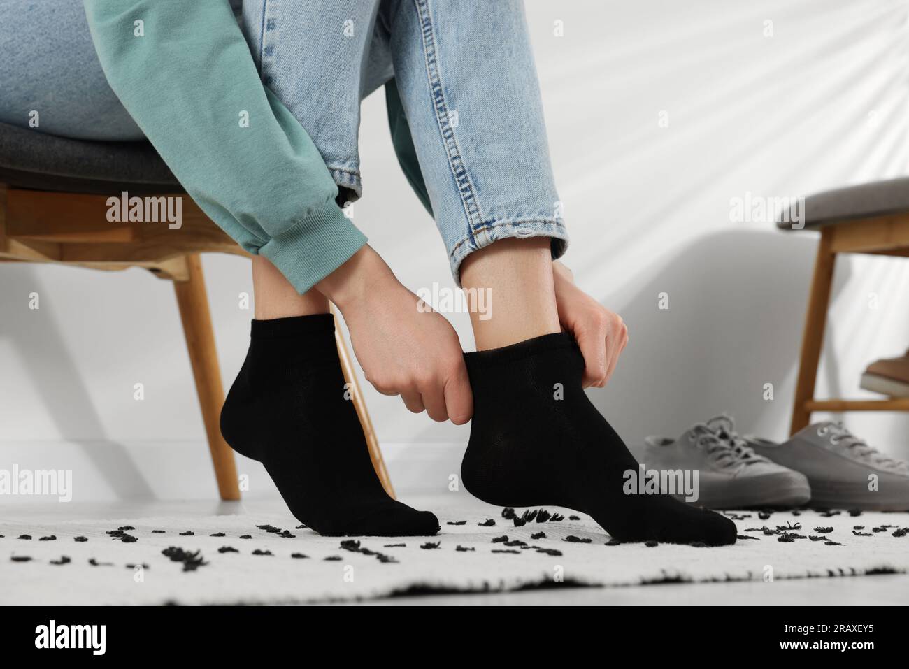 Girl putting clothes on hi-res stock photography and images - Alamy