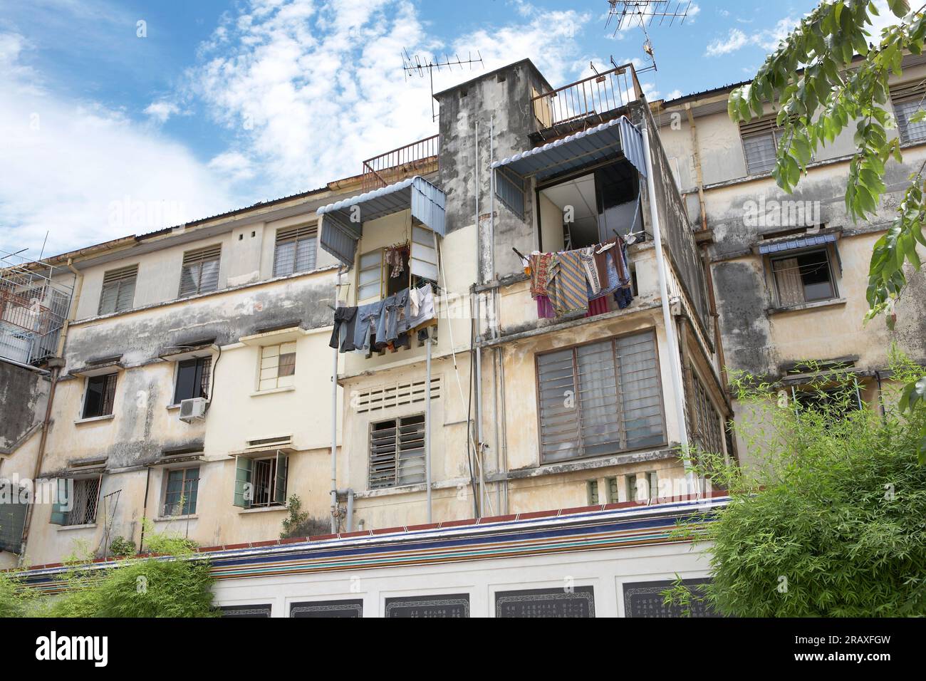 Washing hanging outside a run down apartment block in George Town ...