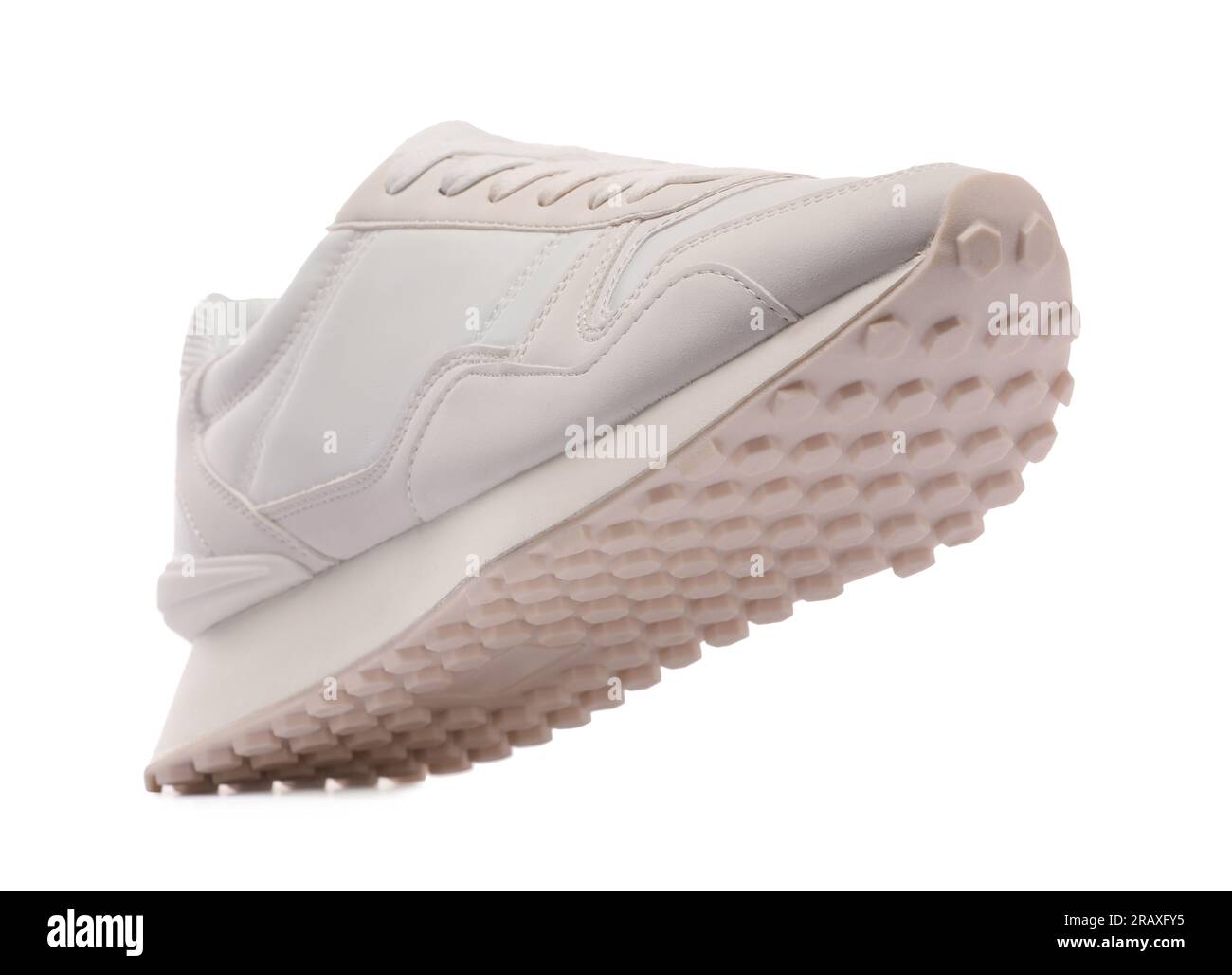 One stylish new sneaker isolated on white Stock Photo - Alamy