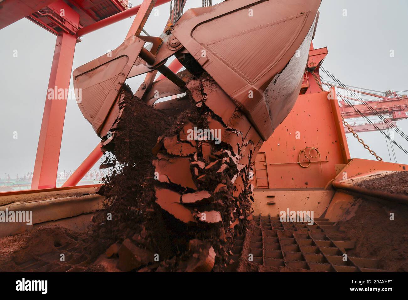 Aerial photo shows a cargo ship unloading iron ores at Dongjiakou ...
