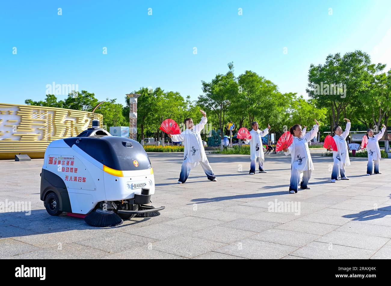 ORDOS, CHINA - JULY 6, 2023 - A self-driving sweeper works at a street ...