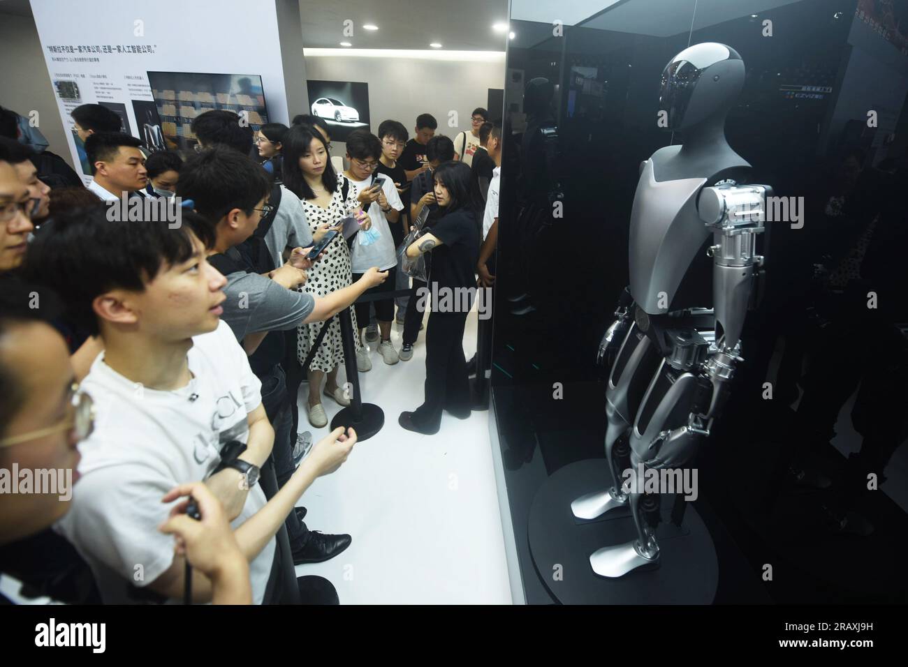 SHANGHAI, CHINA - JULY 6, 2023 - Spectators look at Tesla's humanoid ...