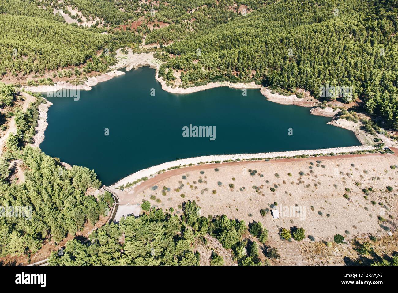 Aerial view of the reservoir pond with beautiful bluish green water ...