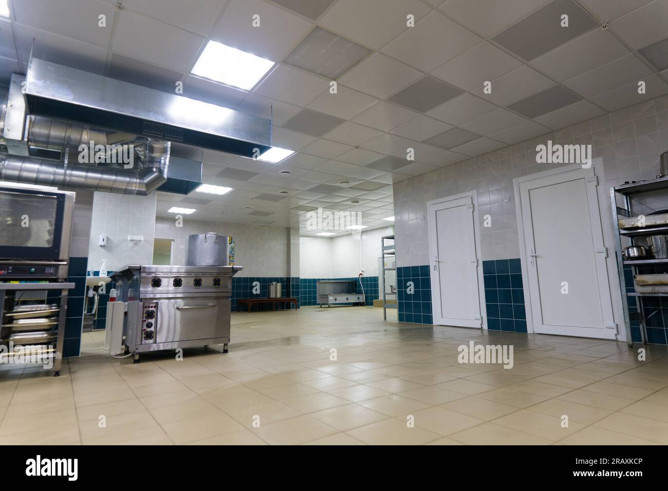 Industrial kitchen in a school restaurant with professional equipment ...