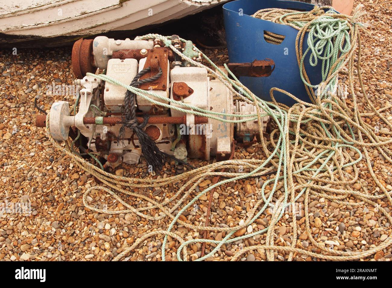 An old Lister boat engine lying on the shingle beach at Aldeburgh ...