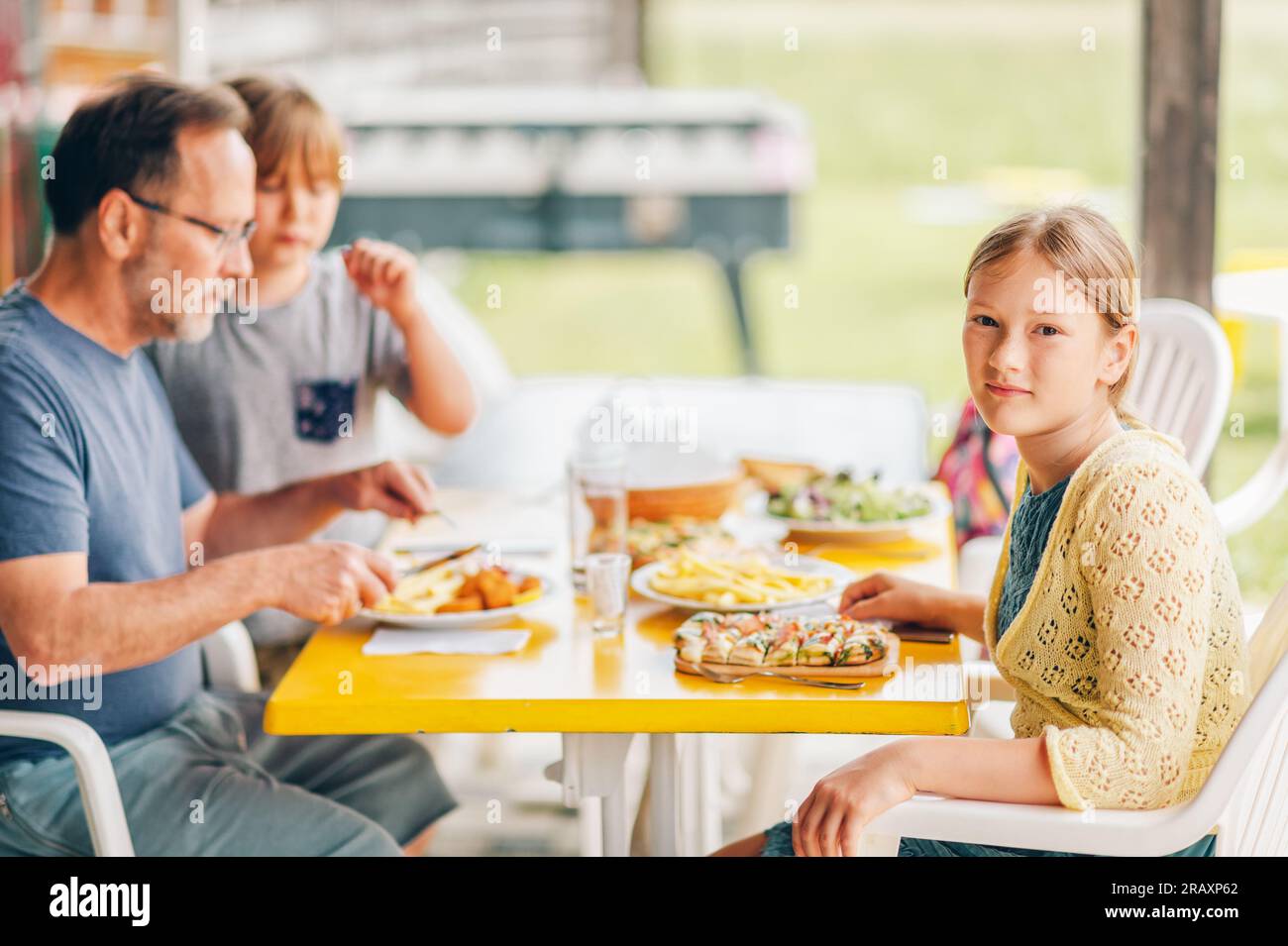 Family having lunch outside on a terrace, background with meal Stock ...
