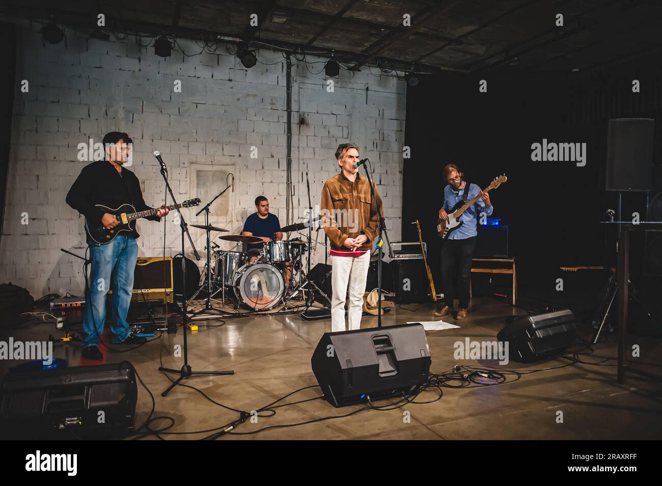 Punk rock music band group have live performance on a stage. Singer ...