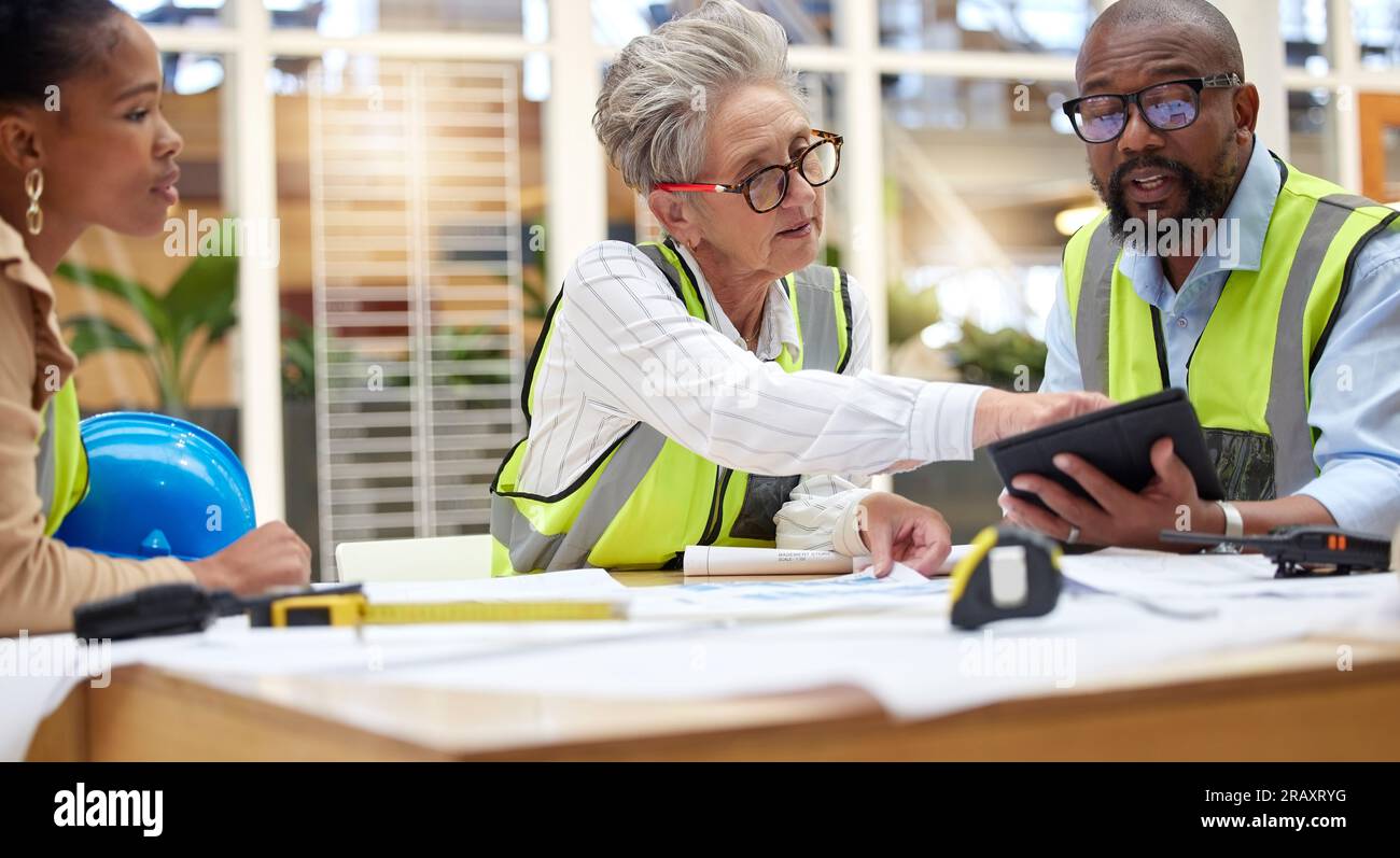 Construction meeting, tablet and engineering people with blueprint ...