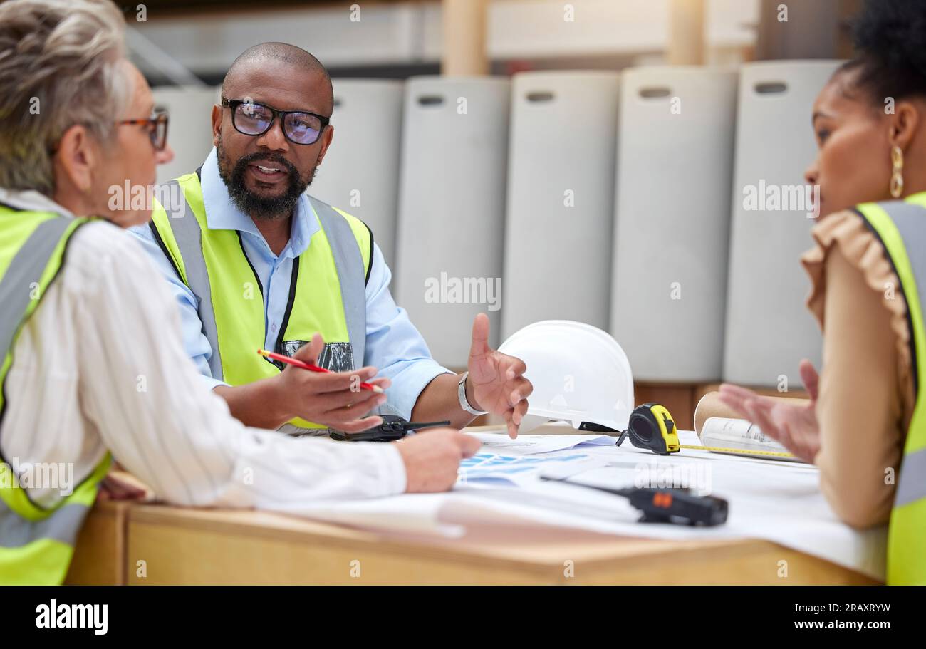 Construction meeting, planning and engineering people with blueprint ...