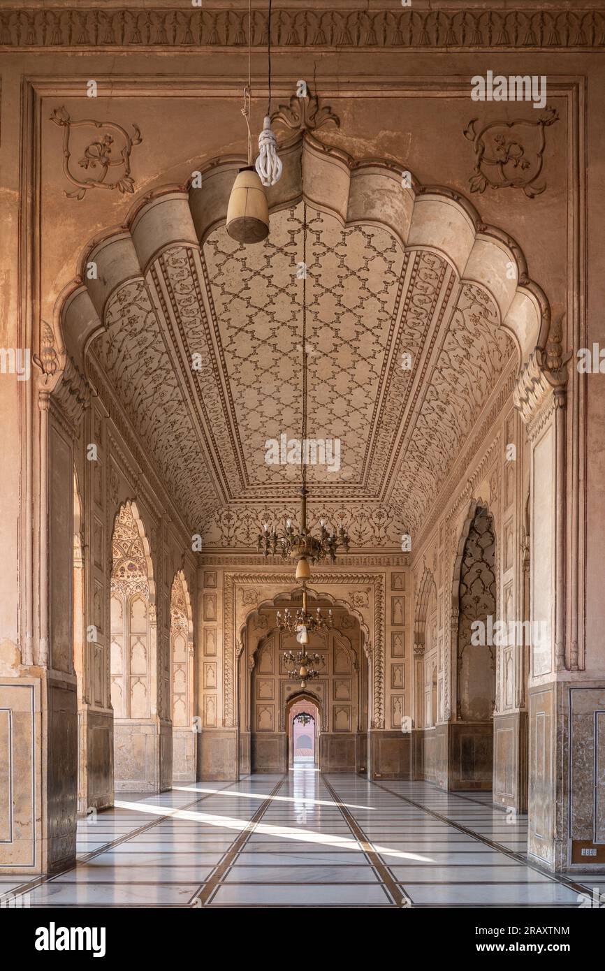Beautiful row of aligned arches behind the facade of ancient Badshahi ...