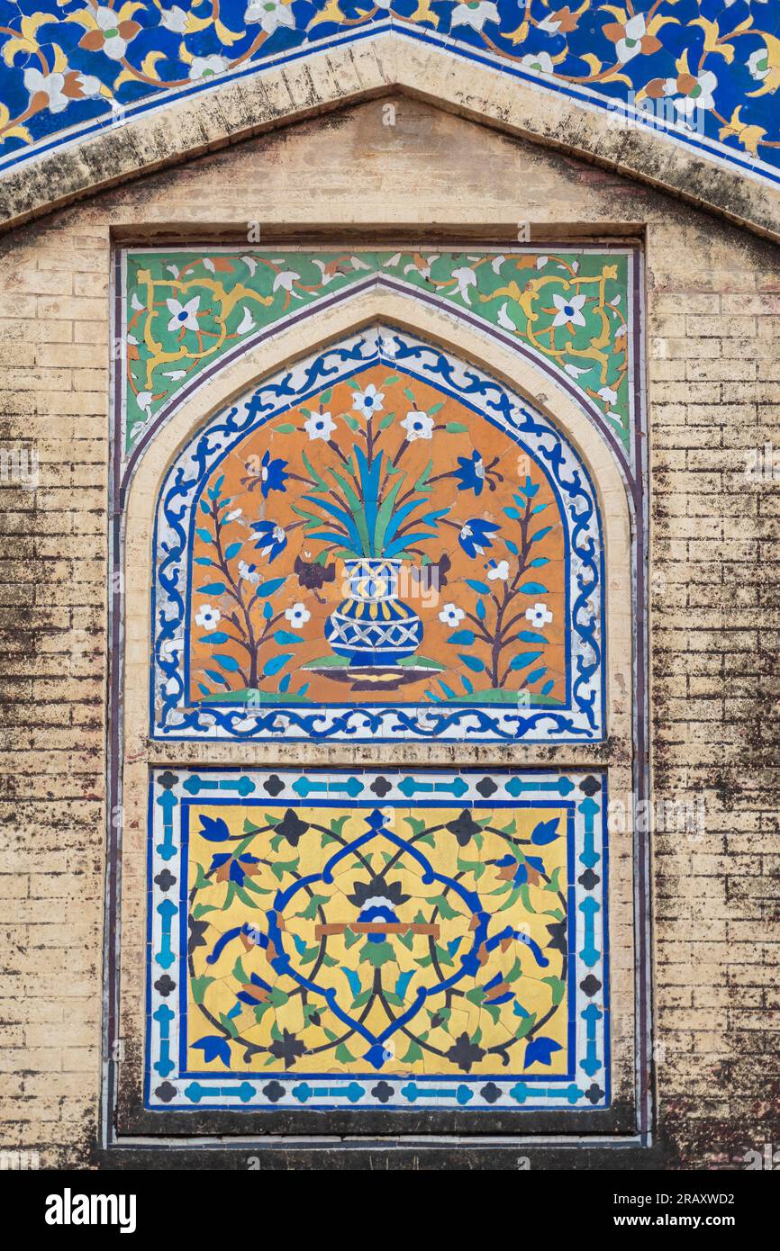 Beautiful colorful kashi-kari or faience tile mosaic design on ancient mughal era Wazir Khan ...