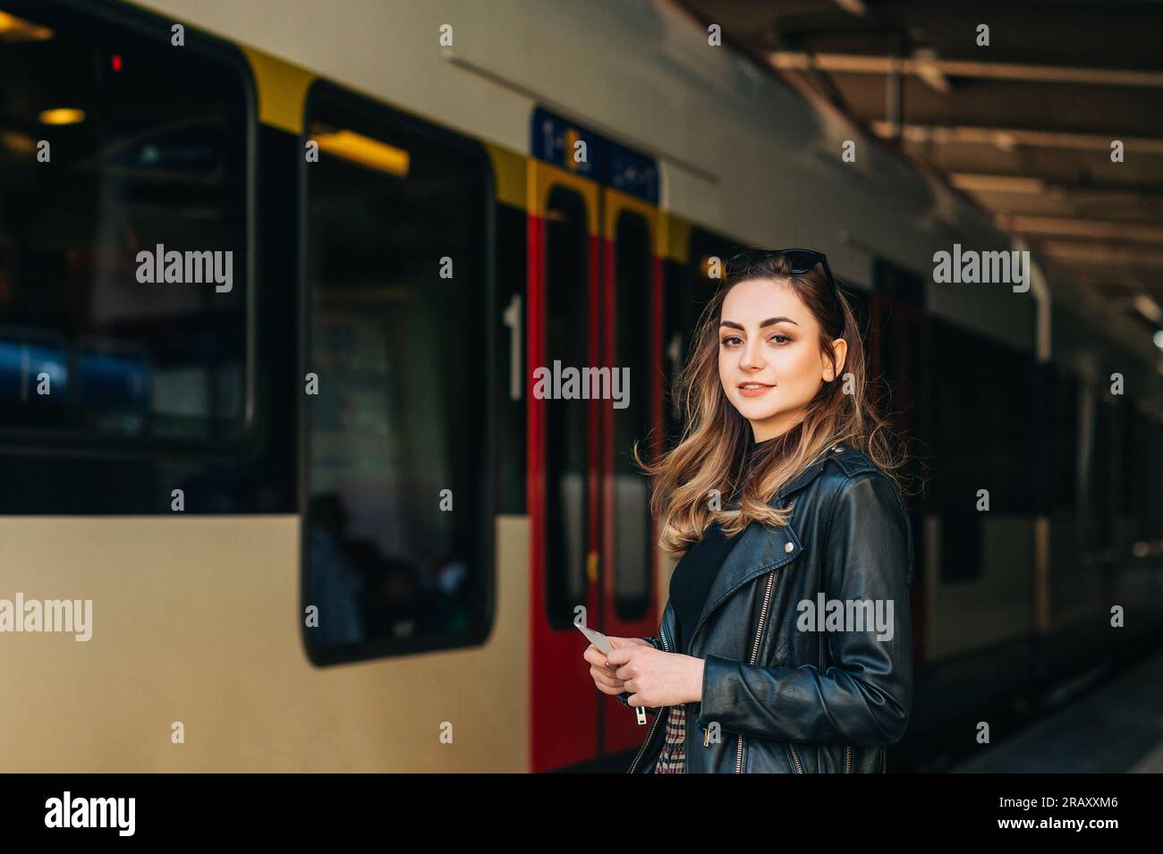 Woman waiting for the train hi-res stock photography and images - Alamy