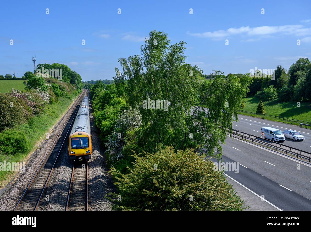 West Midlands Trains class 172 travelling along track running parallel ...