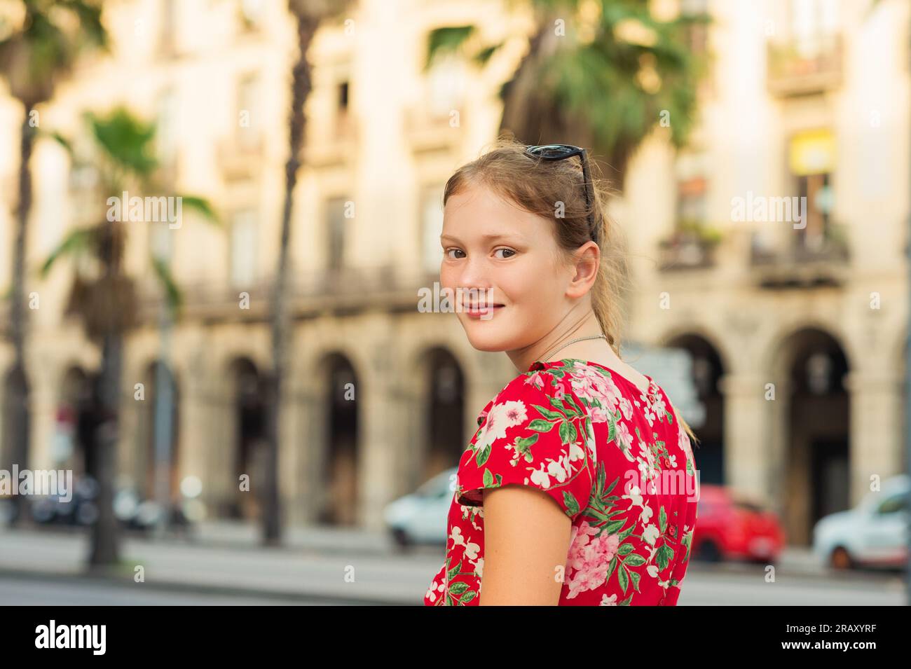 Youg girl tourist walking on the streets of Barcelona, Spain, wearing ...