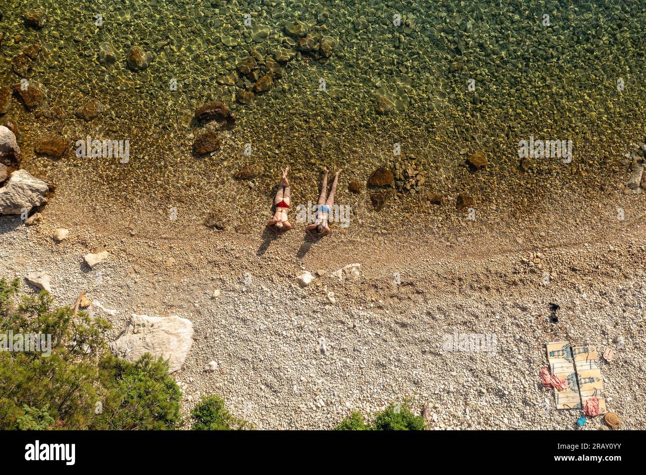 Two young women are swimming on the sea in Rab Island, Croatia Stock ...