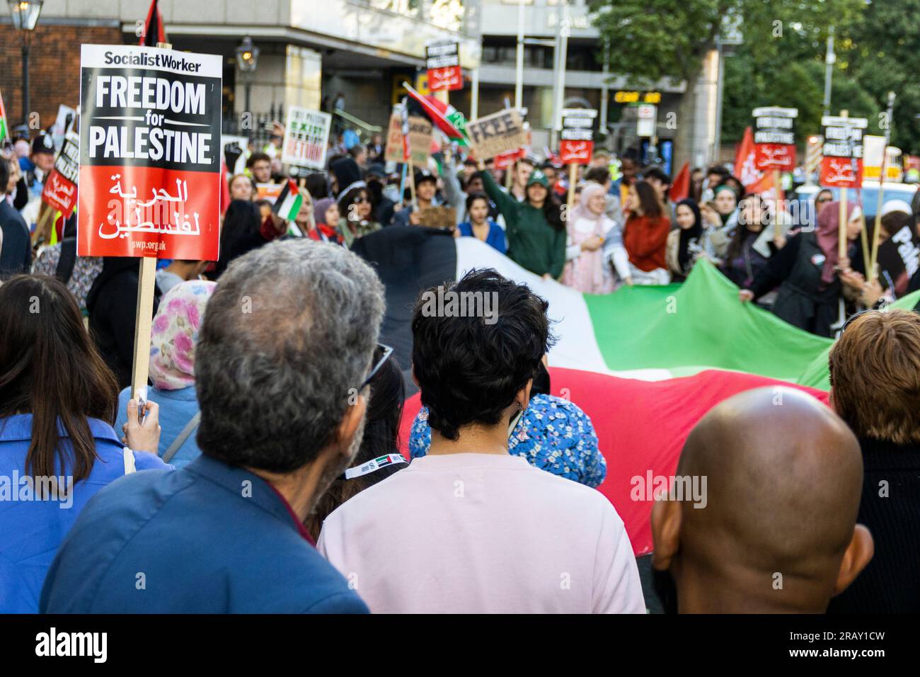 A protest is being held in front of the Israeli Embassy in London, in ...