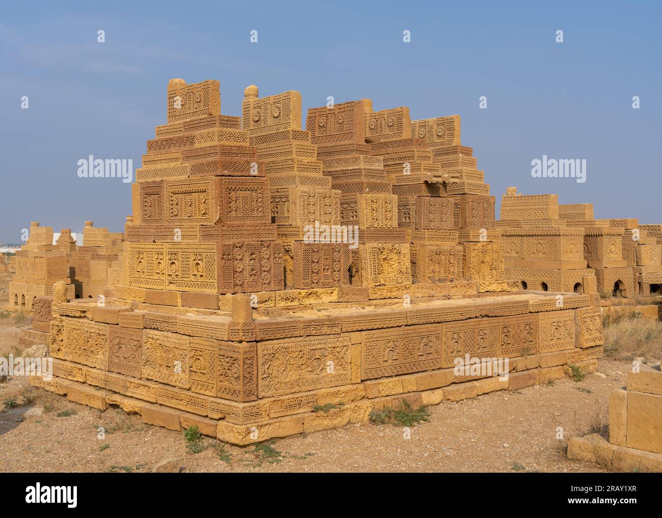 Ancient early islamic carved golden sandstone cenotaphs or tombs on a ...