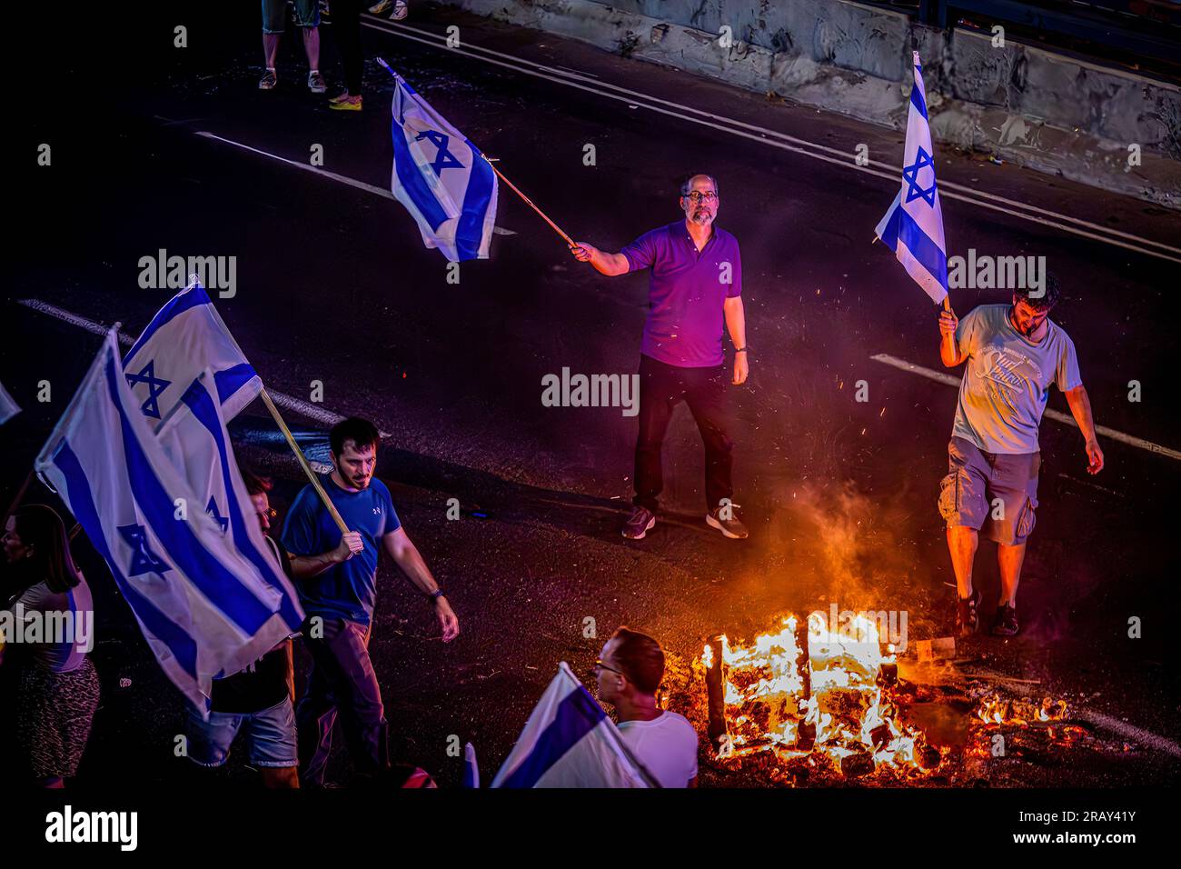 Tel Aviv, Israel. 05th July, 2023. A protestor holds an Israeli flag ...