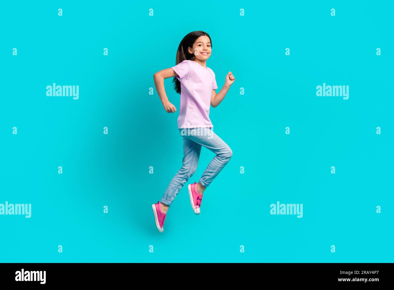 Full body photo of small girl run fast speed have fun wear pink t-shirt ...