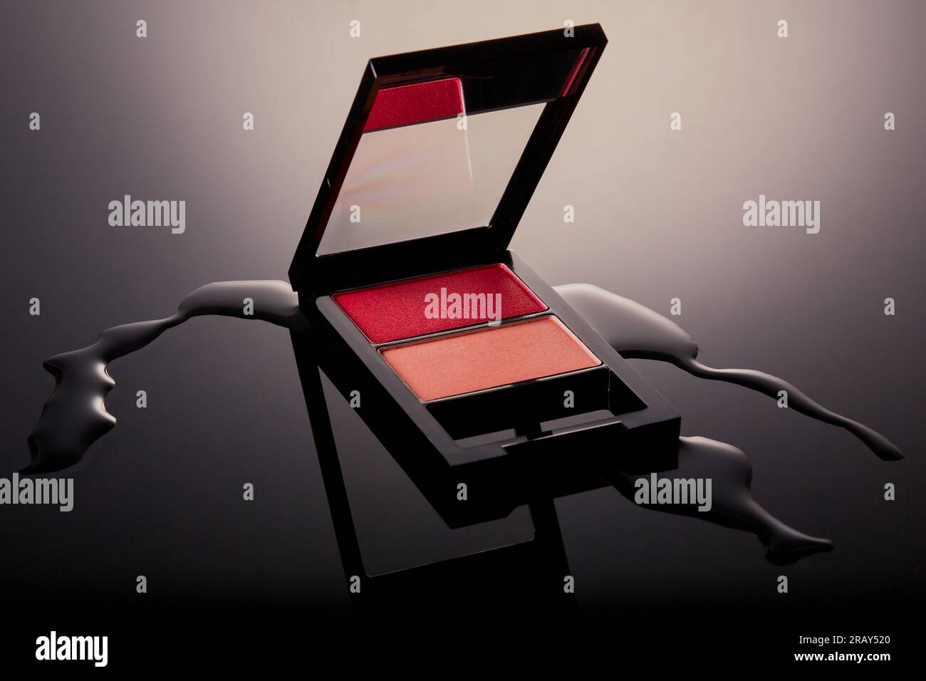 Cosmetic make up compact on a cool gradient background Stock Photo - Alamy