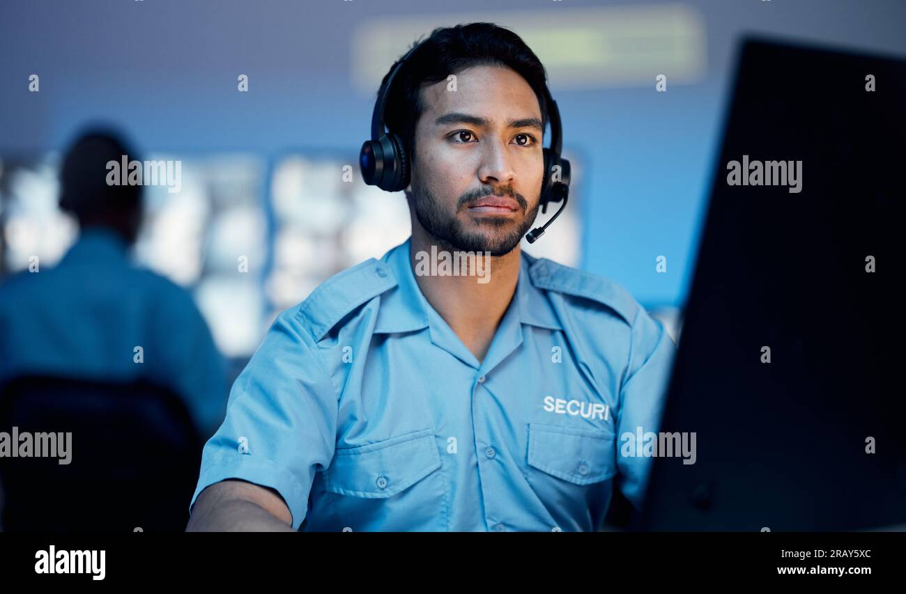 Security guard, monitor and worker man watching screen relax on the job ...