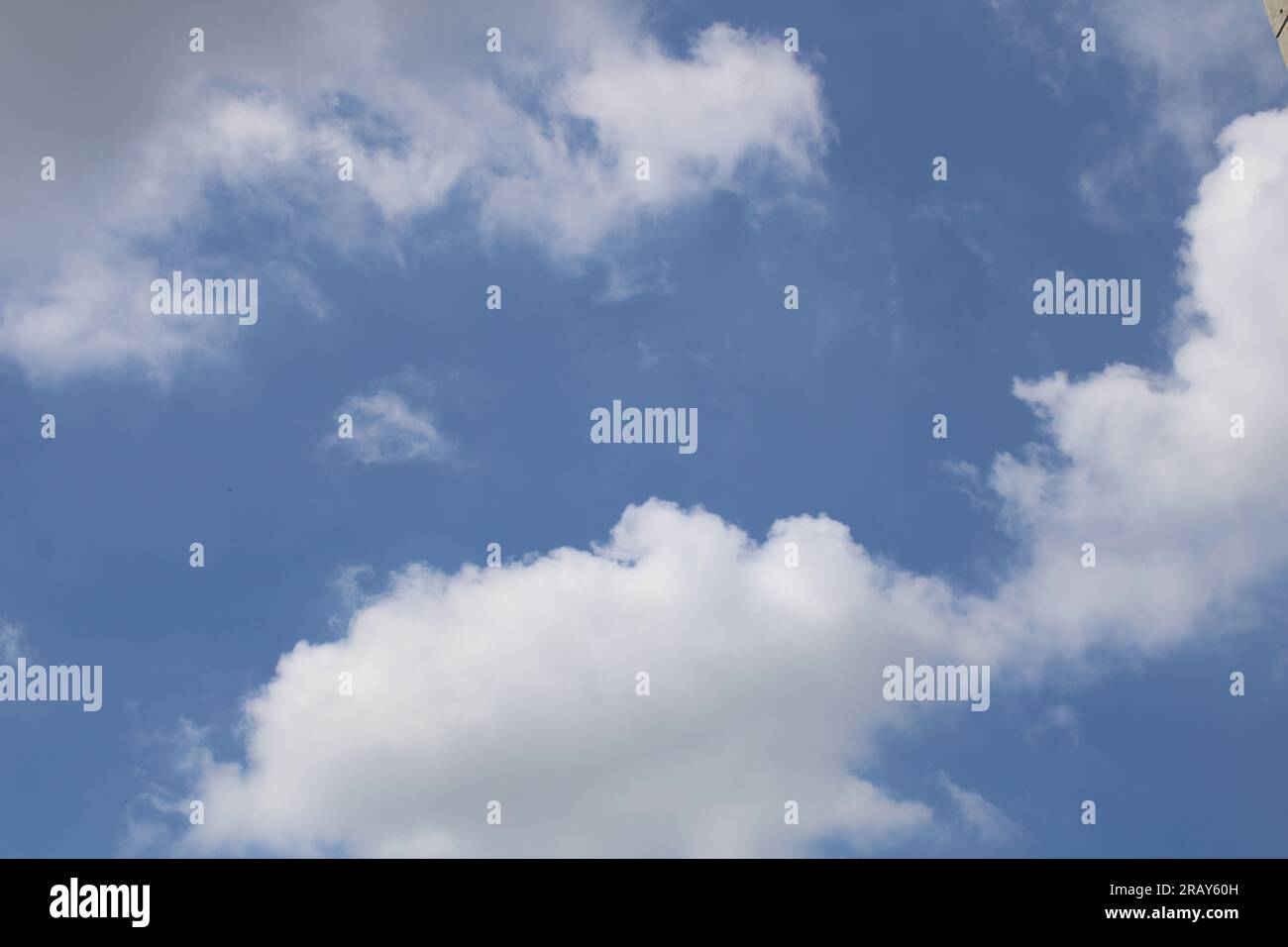 a blue sky with clouds Stock Photo - Alamy