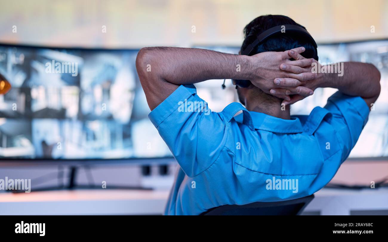 Security guard at desk, relax and cctv monitor for inspection service ...