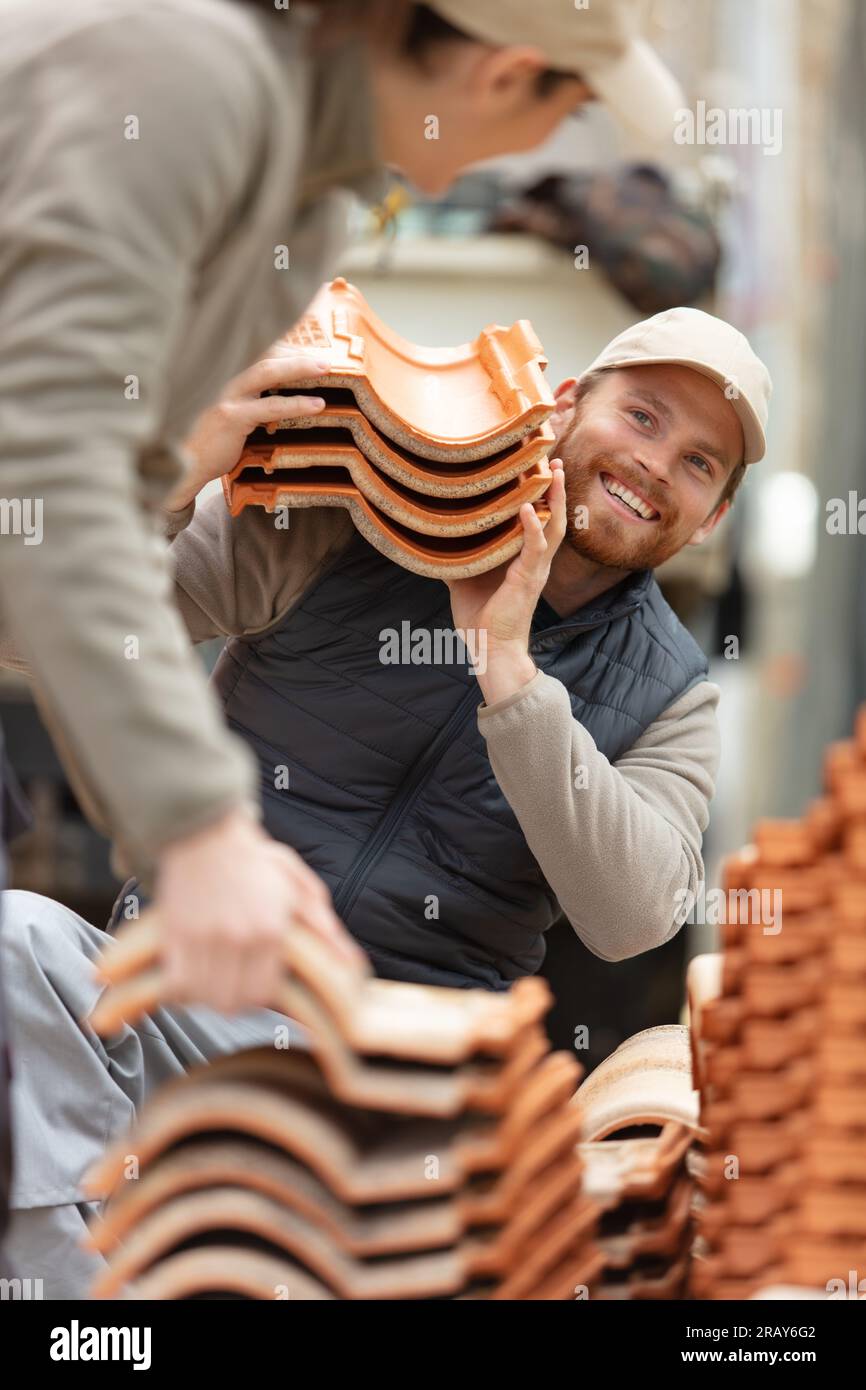 construction workers working on roof structure Stock Photo - Alamy