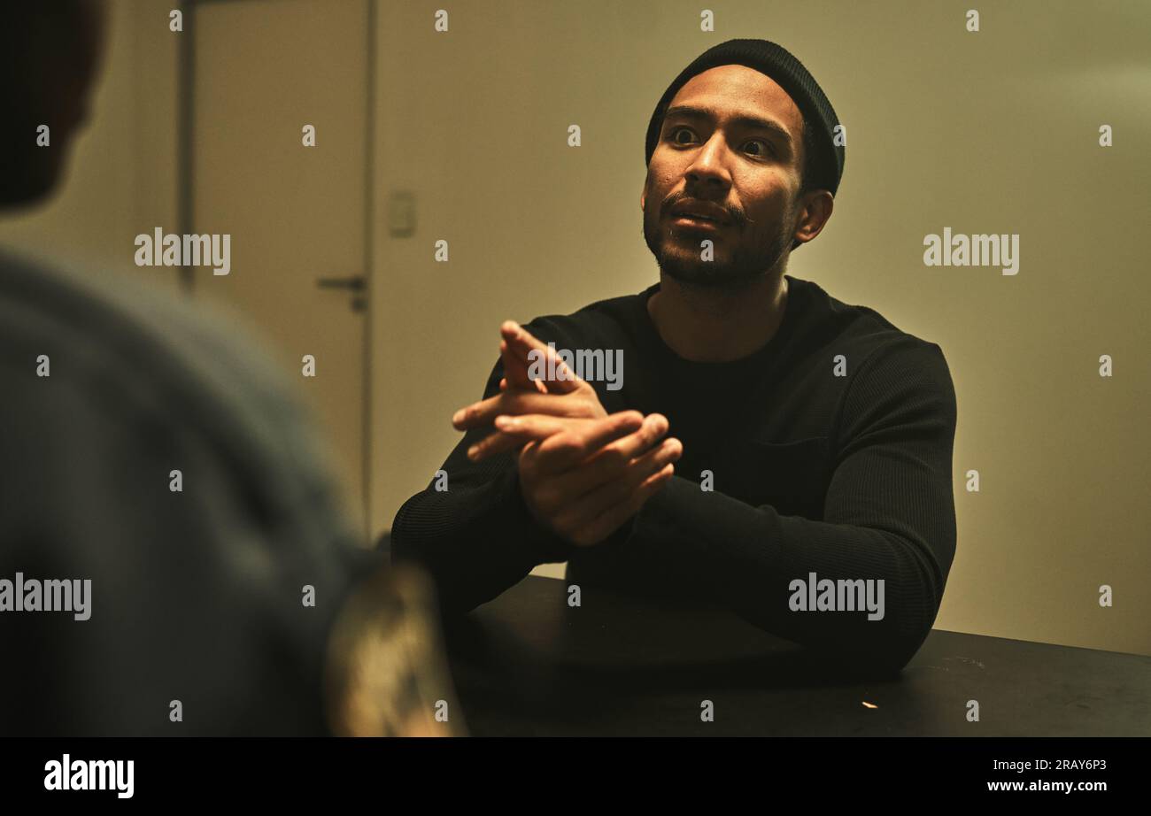 Interrogation, jail and police talking to criminal for interview ...