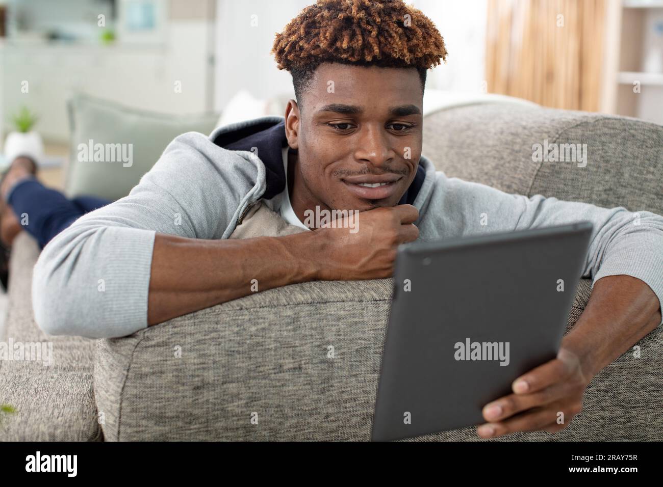 Ethnic teen male tablet hi-res stock photography and images - Alamy