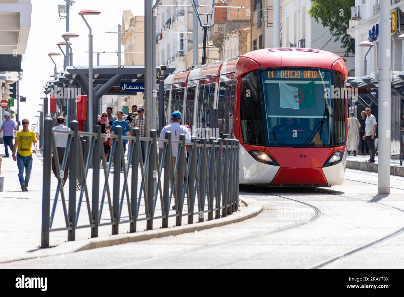 Modern tram crossing the street in Setif city. Transportation concept ...