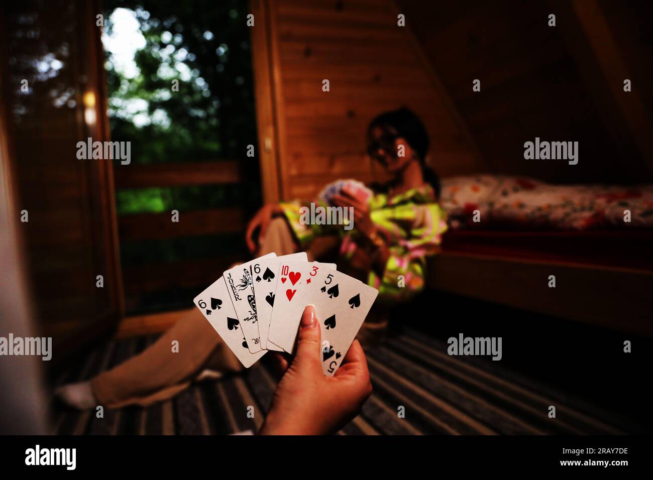 Experience the excitement of a card game through this captivating image ...