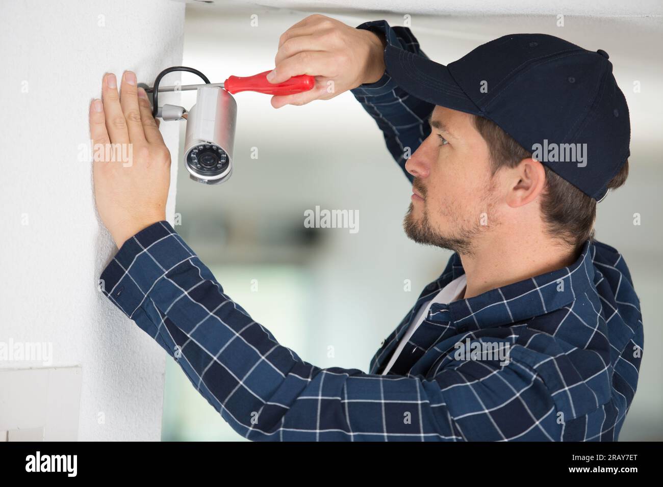 technician installing video surveillance camera Stock Photo - Alamy