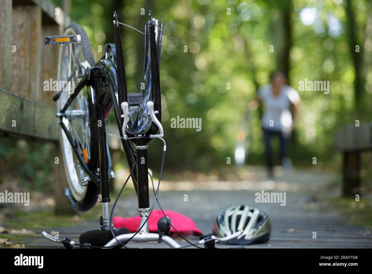 woman walking away from upside down bicycle with puncture Stock Photo ...