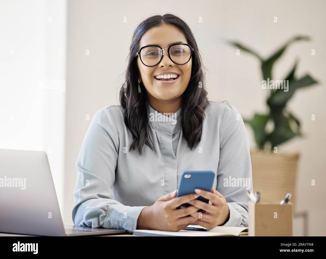 Technology, portrait of happy businesswoman with smartphone and at her ...
