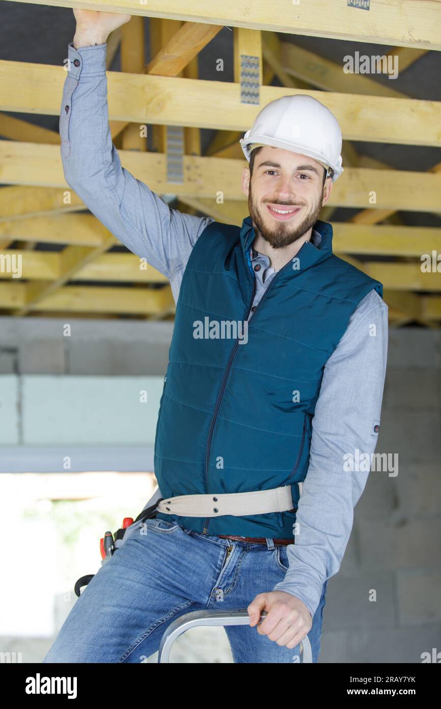 young man working on wood structure Stock Photo - Alamy