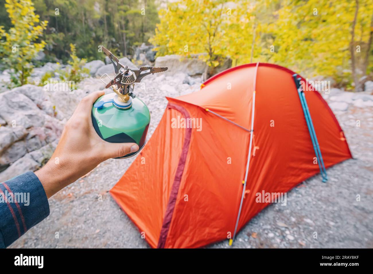 Cooking gear - gas stove at hiking or camping tent. Equipment and ...