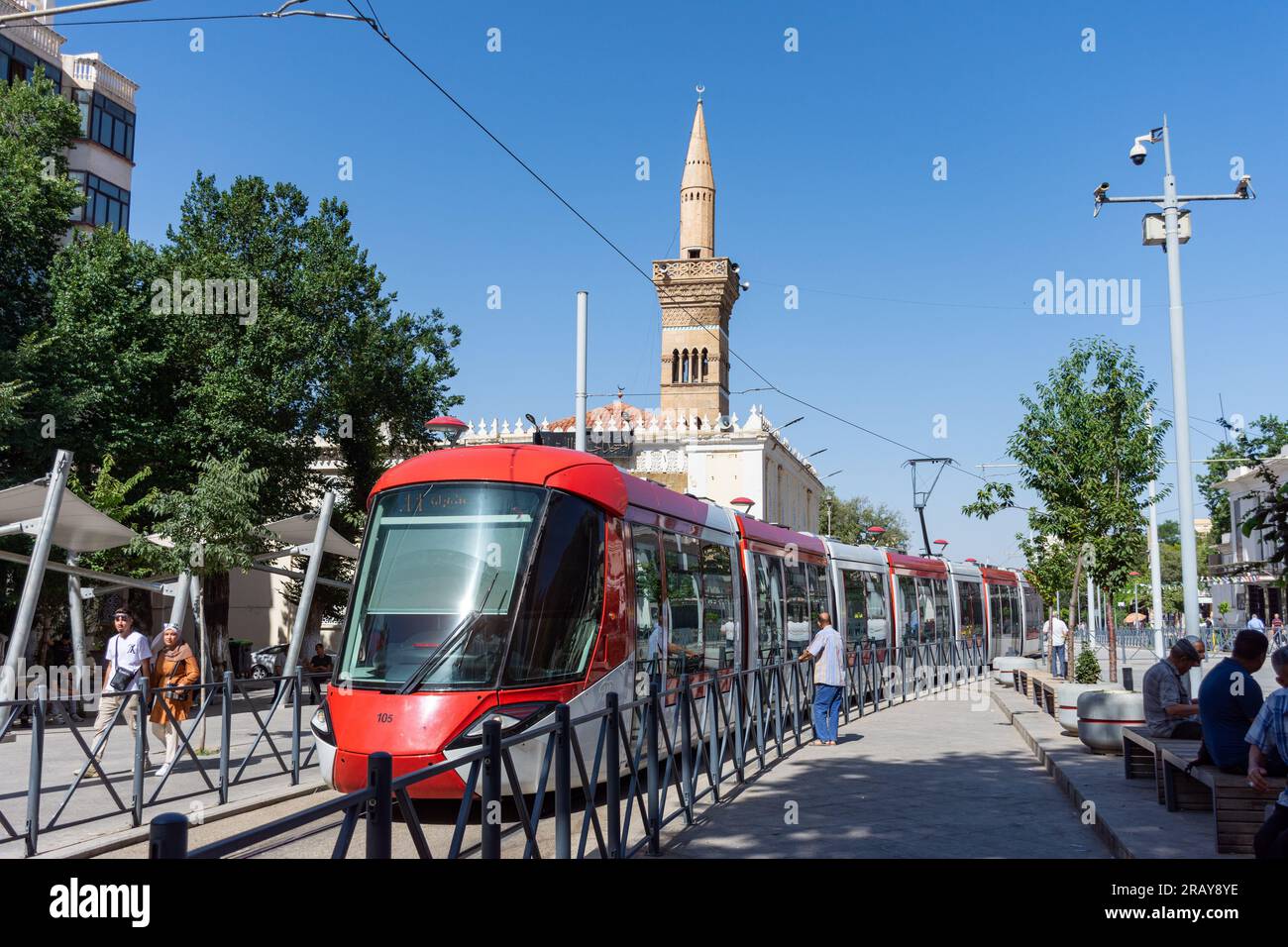 Modern tram crossing the street in Setif city. Transportation concept ...