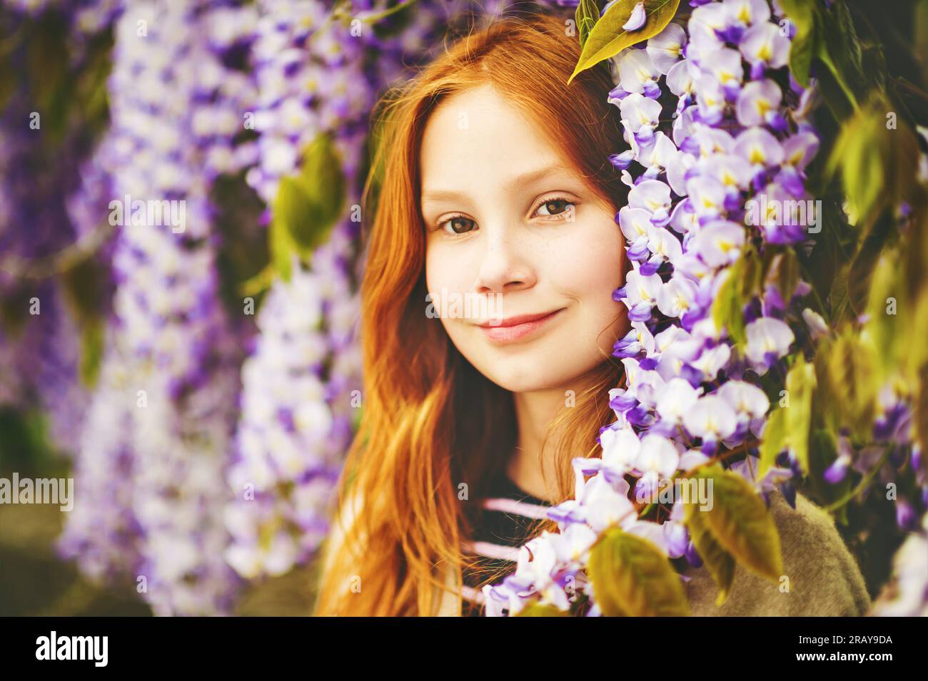 Close up portrait of adorable 9-10 year old red-haired kid girl posing ...