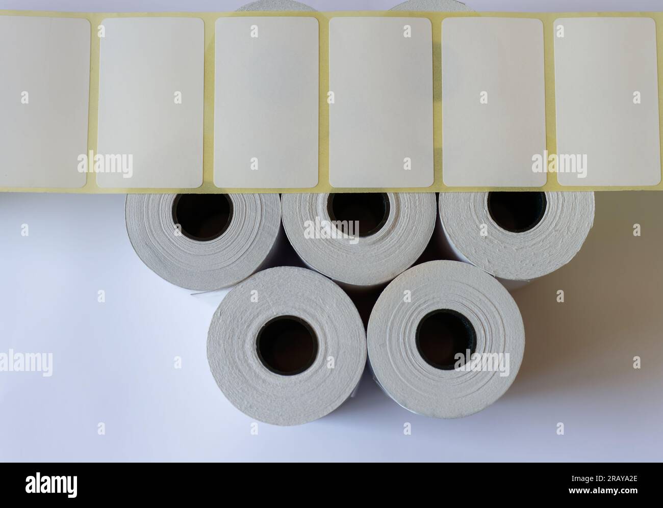 Rolls of white labels isolated. Labels for direct thermal or thermal ...